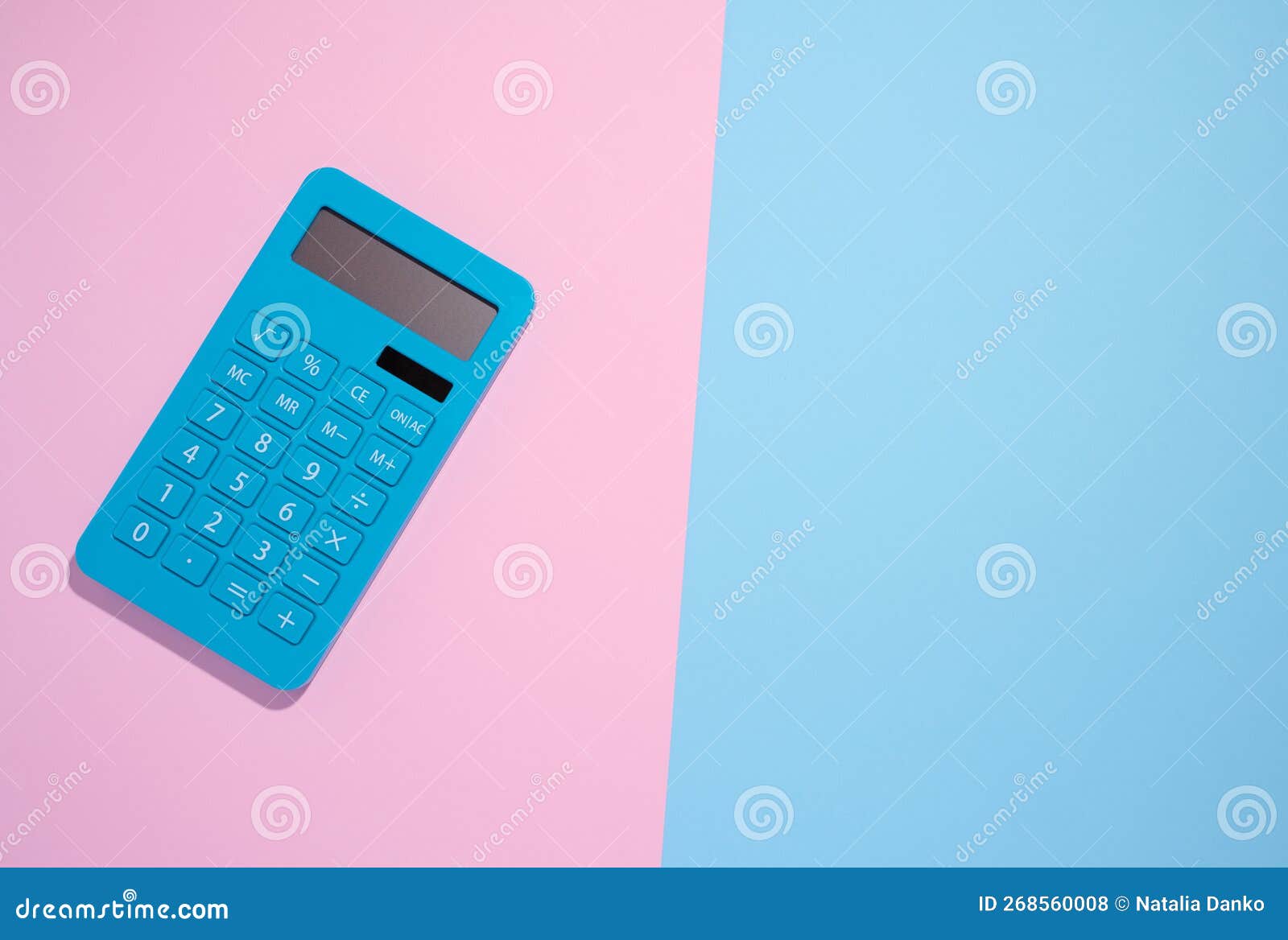 Blue Plastic Calculator on a Blue Background, Top View Stock Photo ...