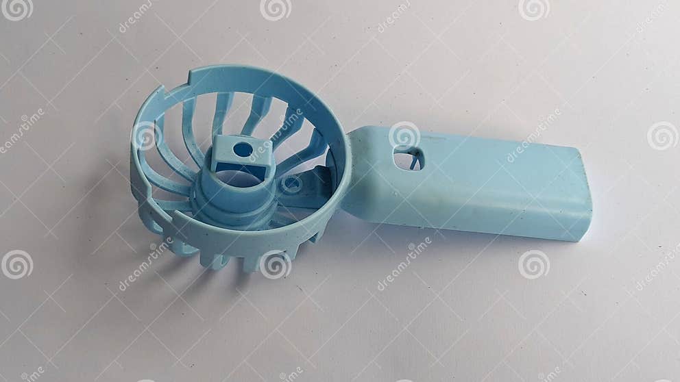 A Blue Plastic Component with a Fan-like Structure. the Component Has a ...