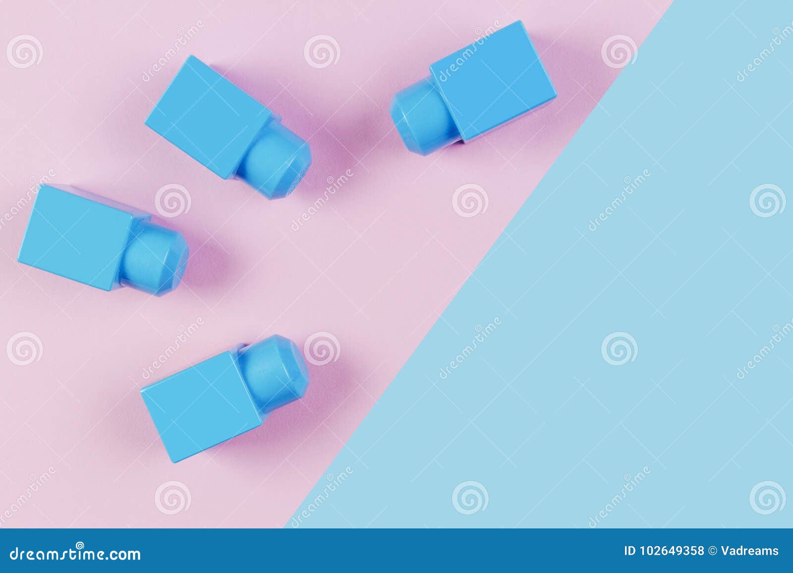 Blue Plastic Construction Blocks on Pink and Blue Background Stock ...
