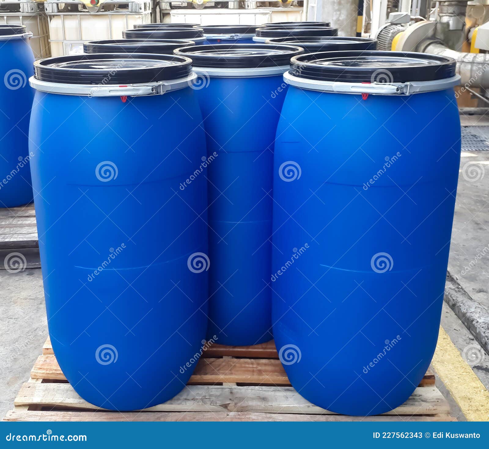 Blue Plastic Drums on Wooden Pallet Stock Image - Image of barrel, ring ...