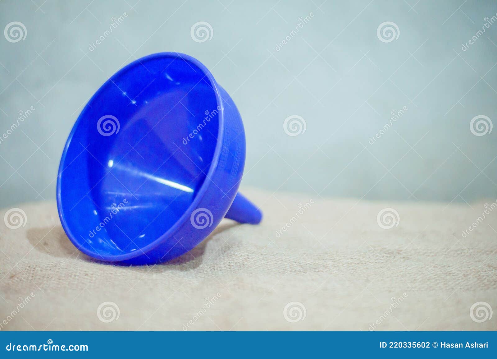 Blue Plastic Funnel on Table on Blue Background Stock Photo - Image of ...