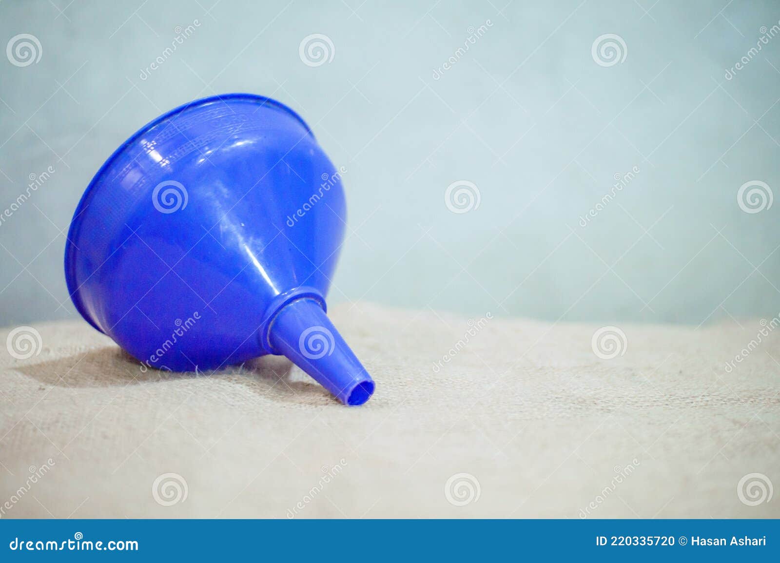 Blue Plastic Funnel on Table on Blue Background Stock Photo - Image of ...