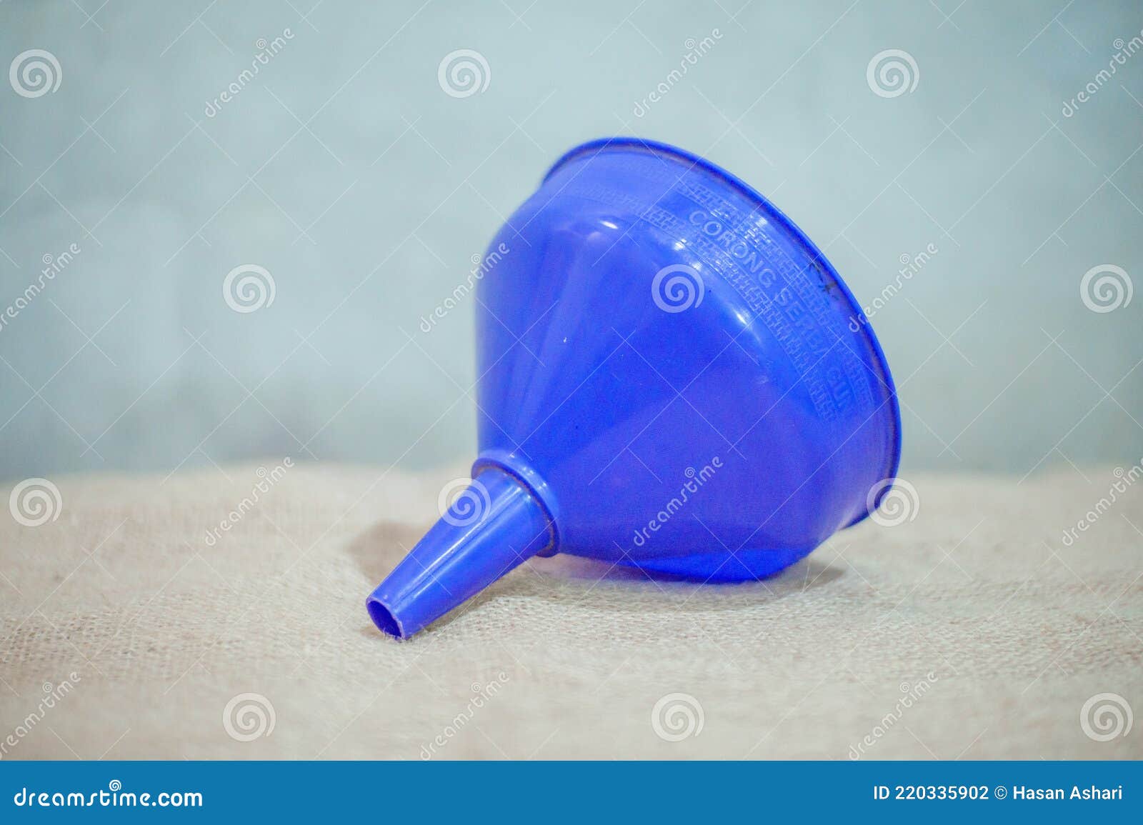 Blue Plastic Funnel on Table on Blue Background Stock Photo - Image of ...