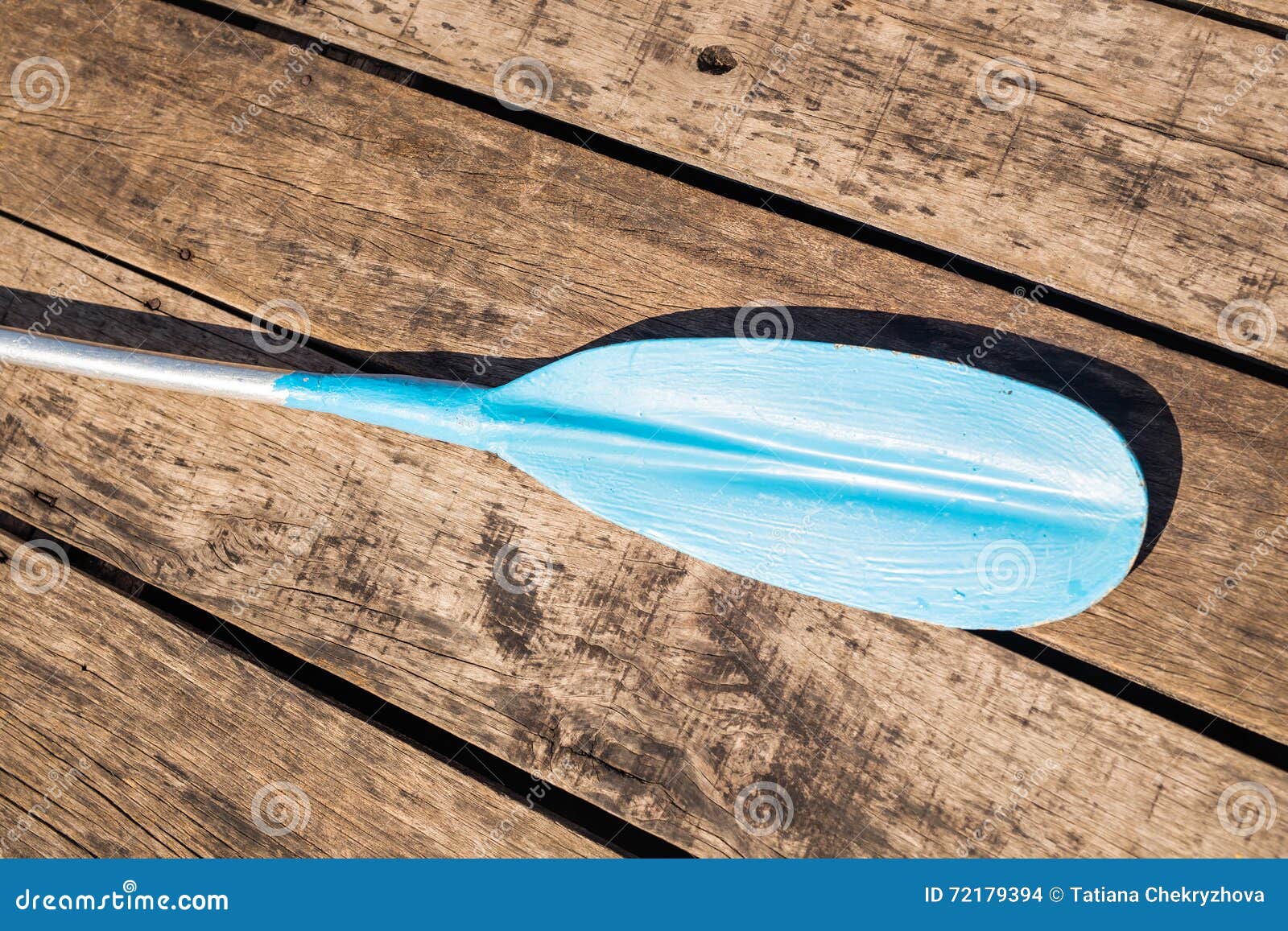 Blue Plastic Kayak Paddle on Wooden Background Stock Photo - Image of ...