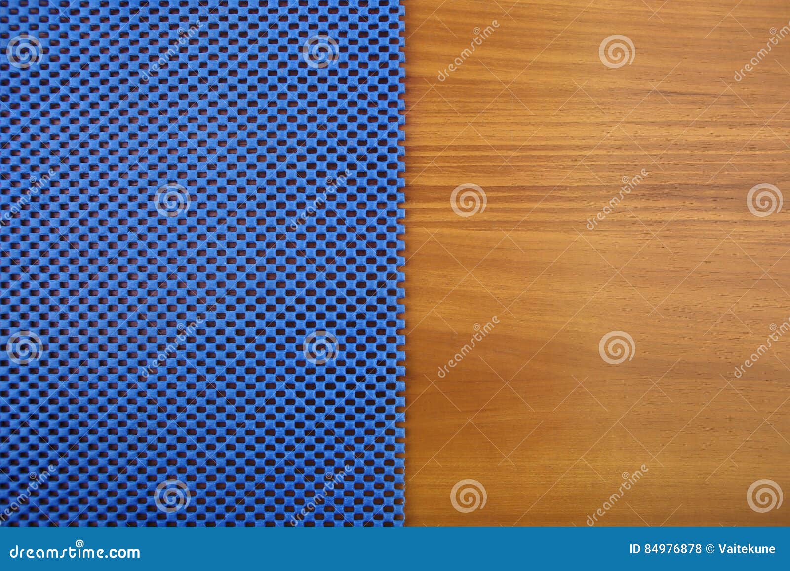 Blue Plastic Mat on Wooden Background. Stock Photo - Image of grid ...
