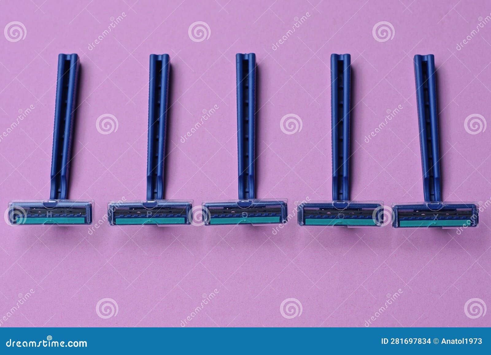 Blue Plastic Razors Lie on a Pink Table Stock Photo - Image of grooming ...