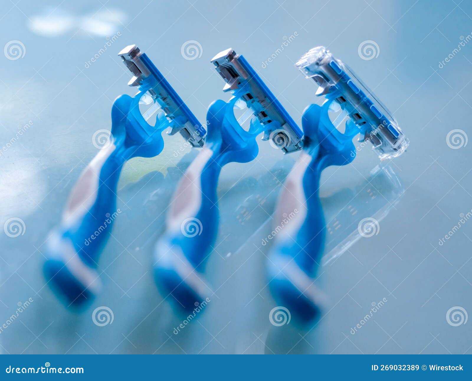 Blue Plastic Razors on the Shiny Mirror Stock Image - Image of grooming ...