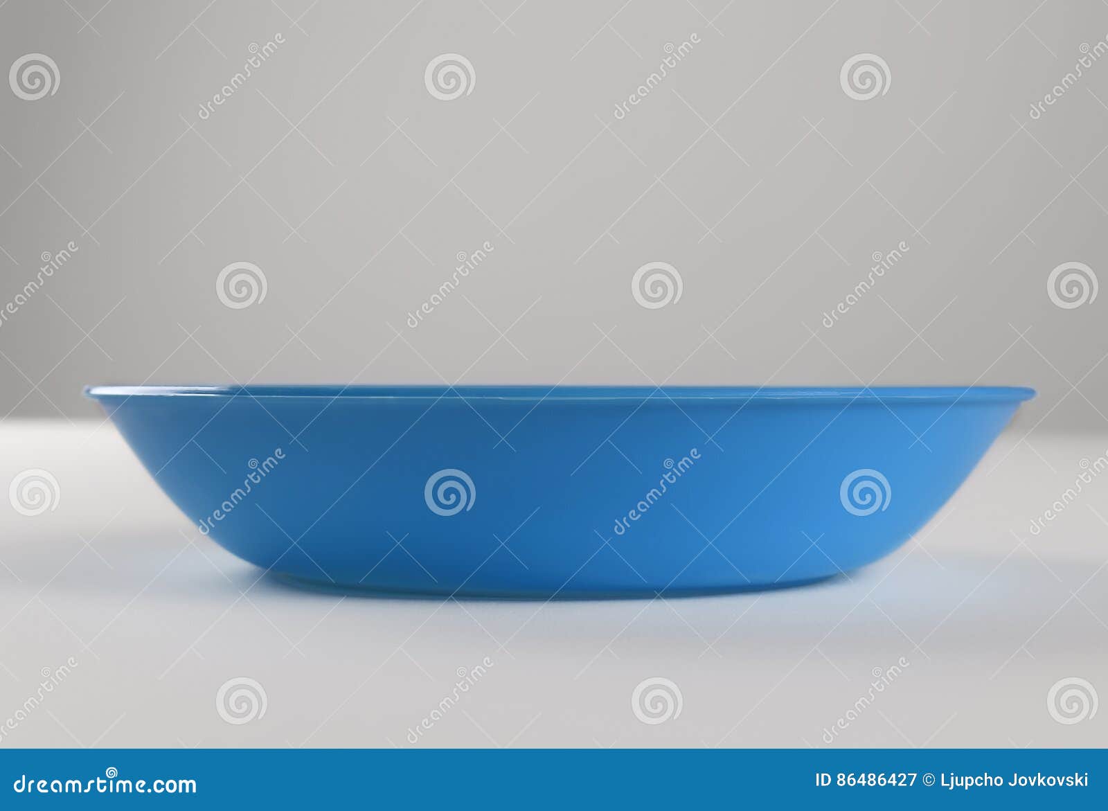 Blue plastic shallow dish stock image. Image of plain - 86486427
