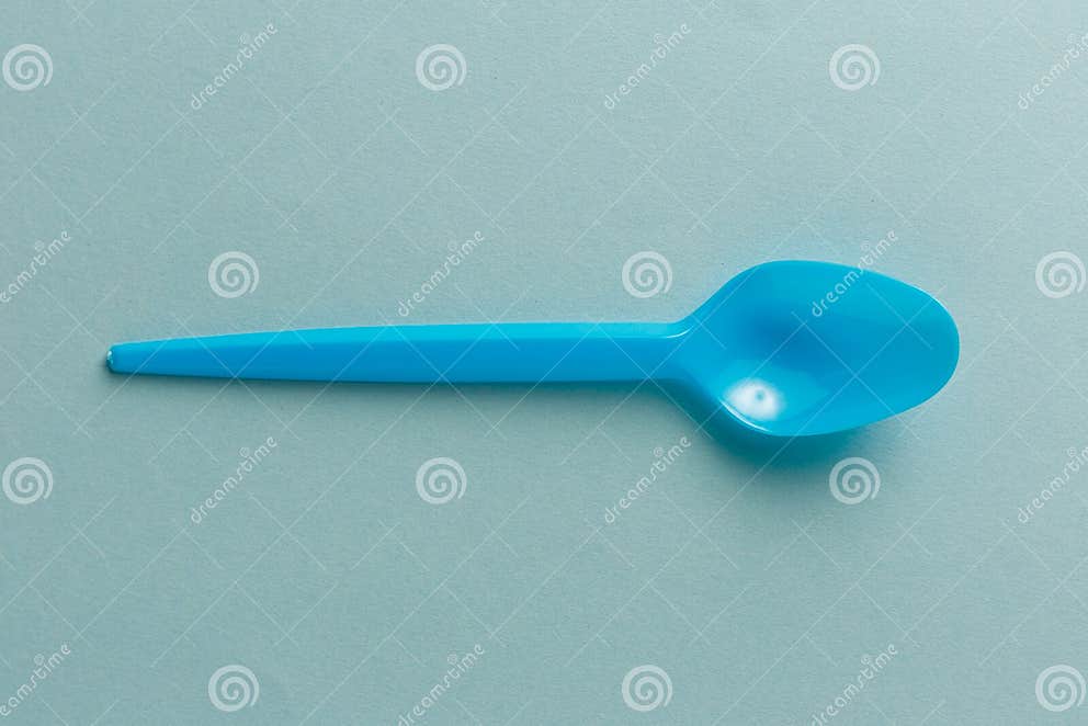 Blue Plastic Spoon on a Blue Background Stock Photo - Image of stuff ...