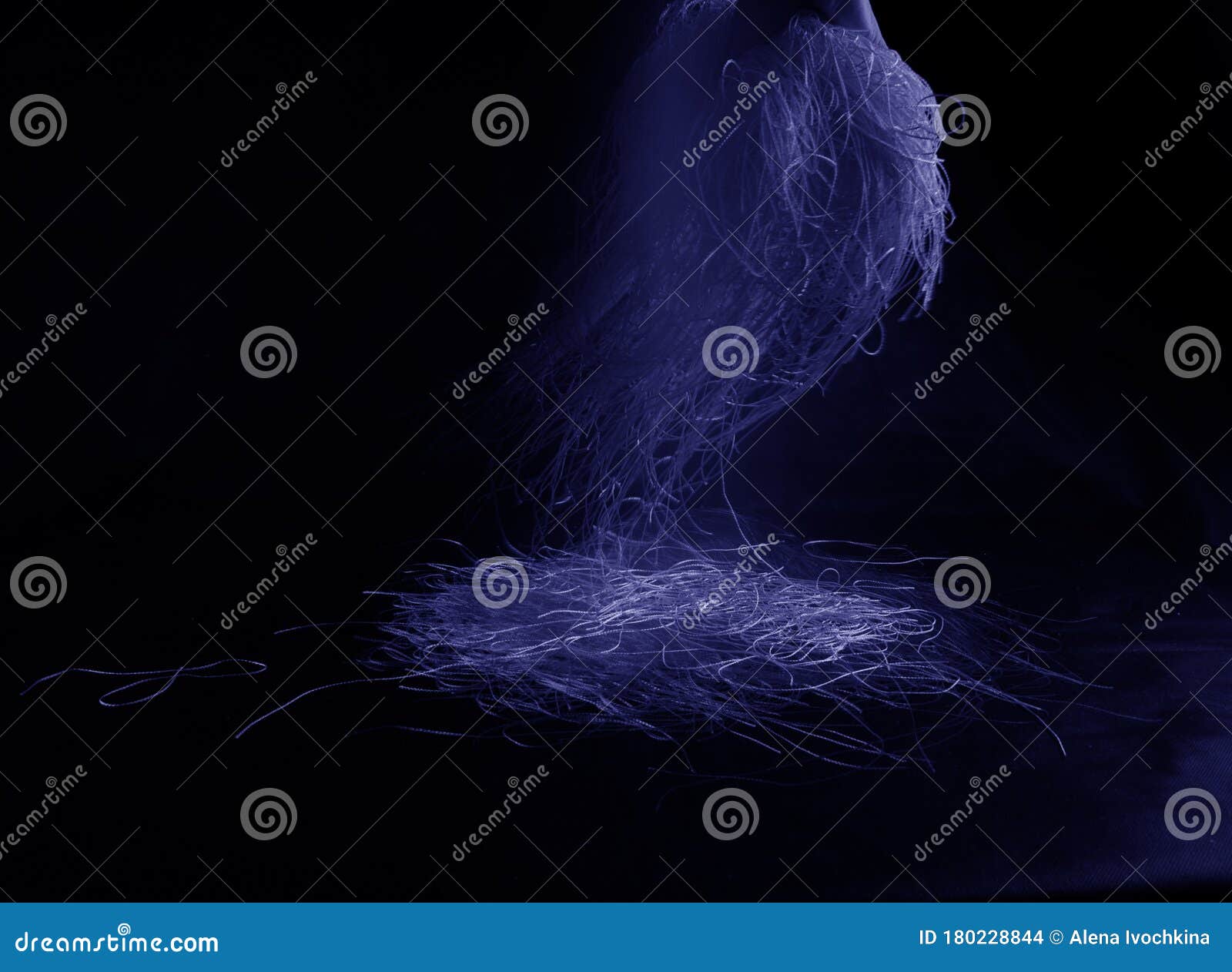 Blue, Purple Tangled Threads Hang and Fall on a Black Background ...