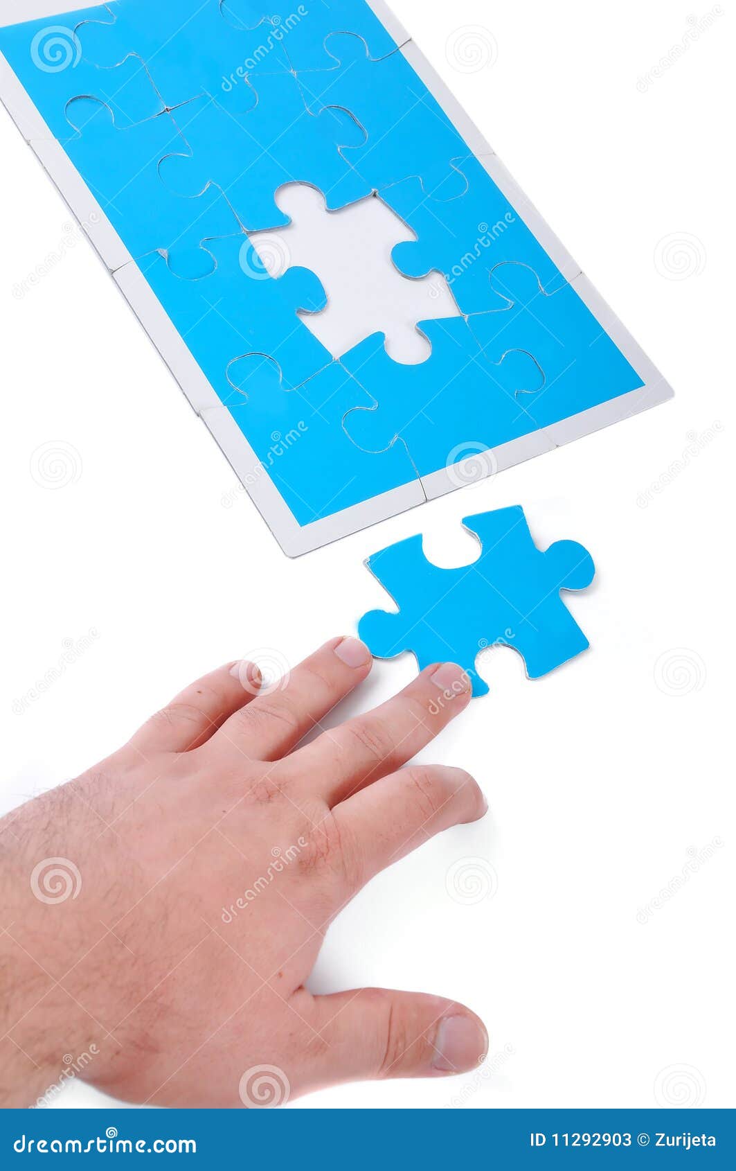 Blue puzzle and hand stock image. Image of love, piece - 11292903