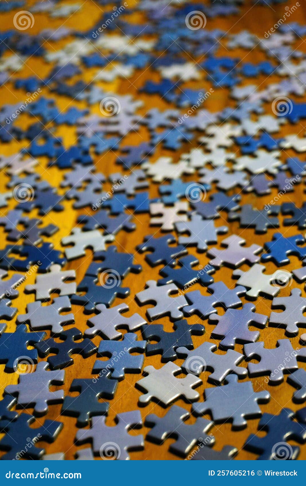Blue Puzzle Tabs on the Wooden Table, Vertical, Close-up Stock Photo ...
