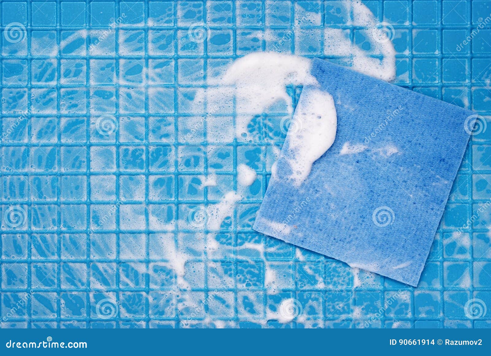 Blue rag in white foam stock photo. Image of surface - 90661914