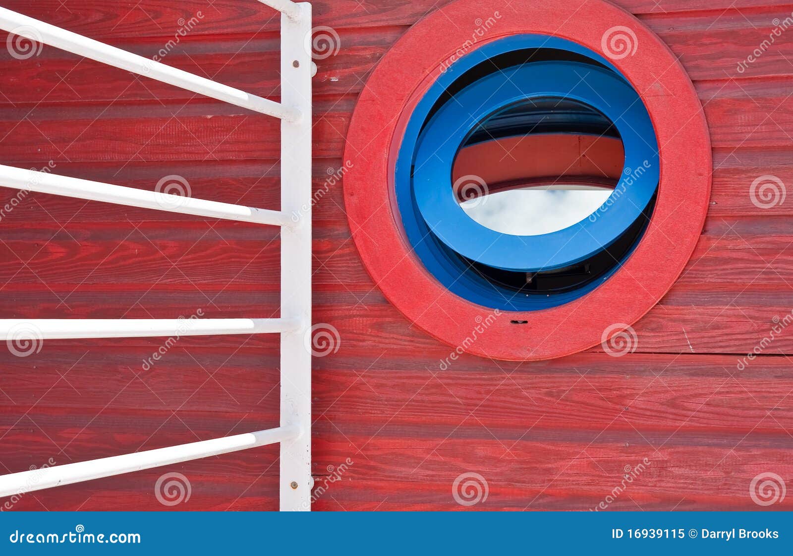 Blue and Red Round Window in a Red Wooden Wall Stock Image - Image of ...