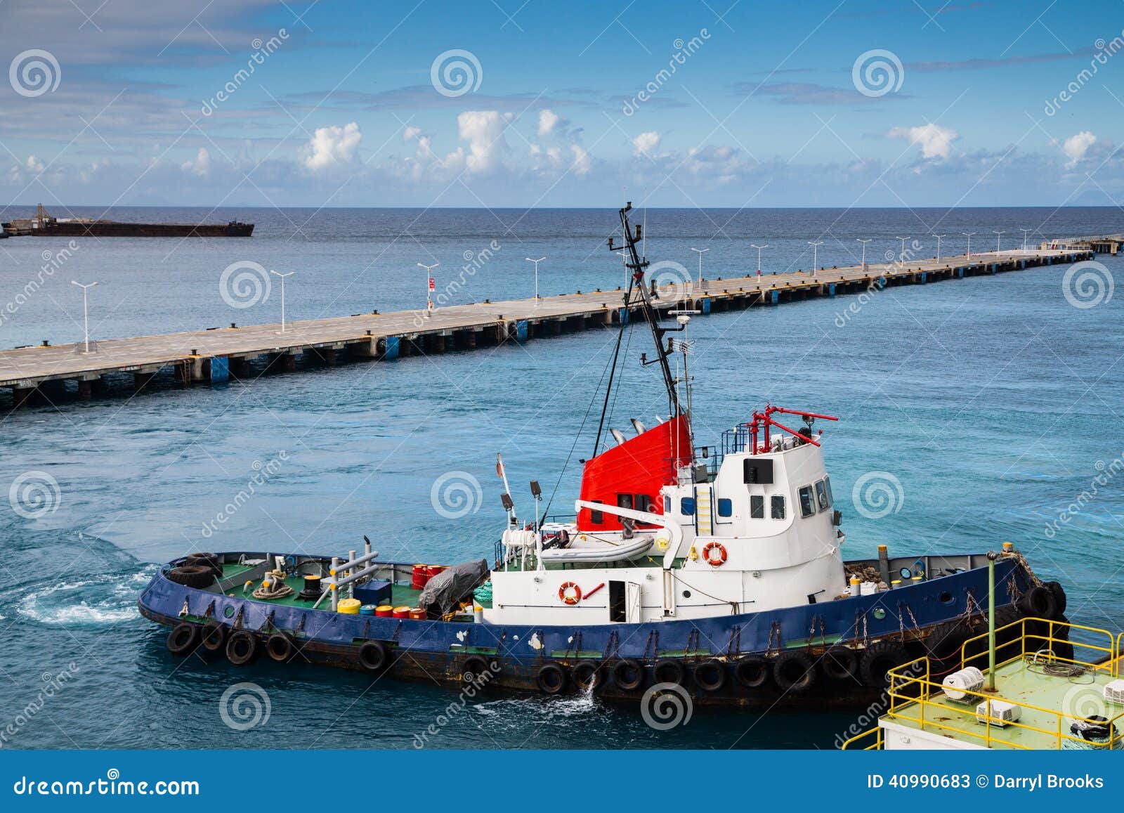 Blue and Red Tugboat in Blue Harbor Stock Image - Image of maritime ...
