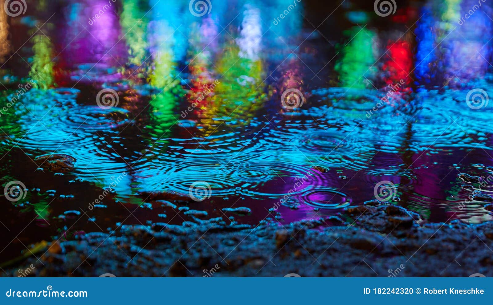 Blue Reflections in the Water when it Rains at a Fun Fair Stock Photo ...