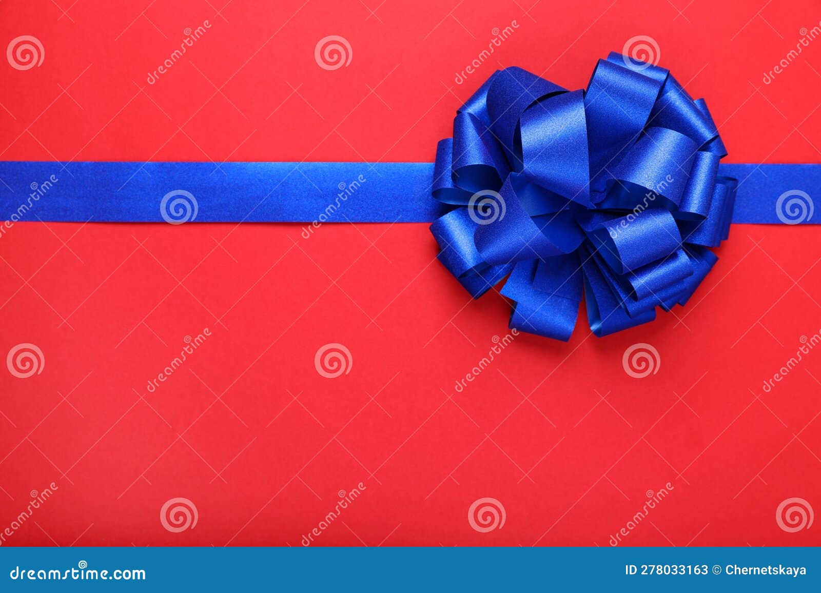 Blue Ribbon with Bow on Red Background, Top View. Space for Text Stock ...