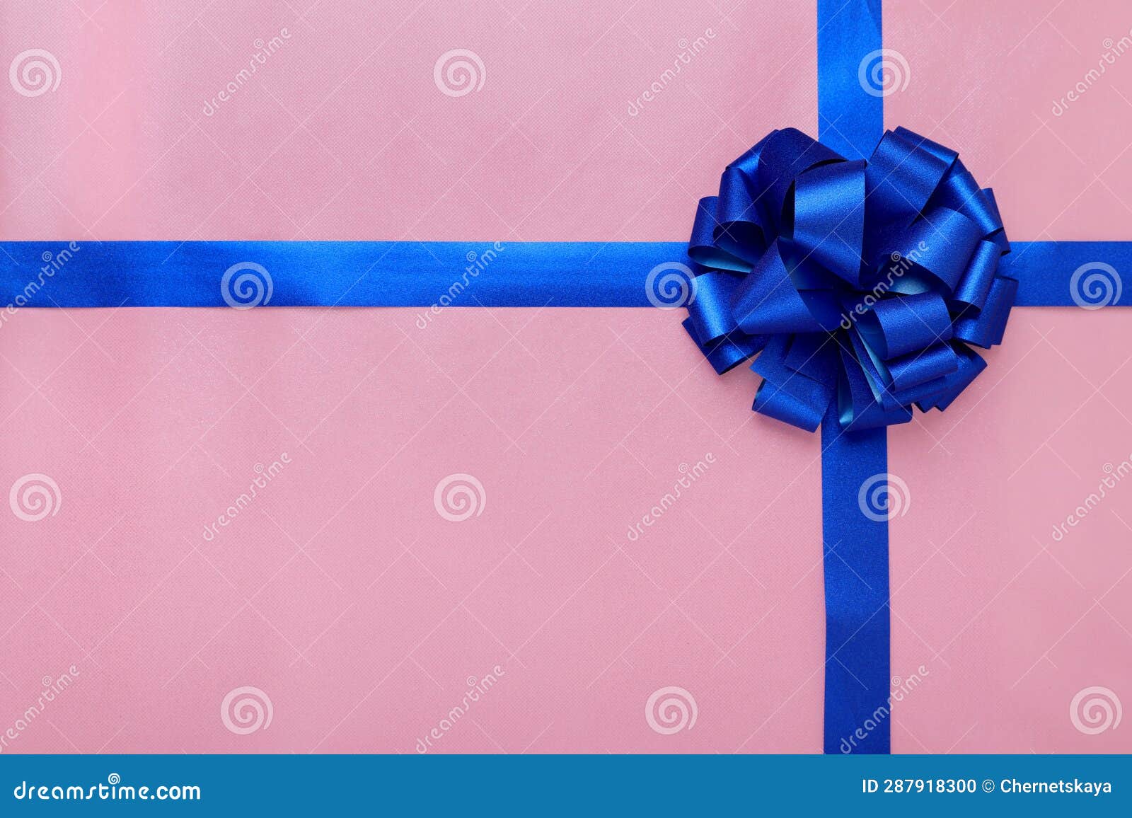 Blue Ribbons with Bow on Pink Background, Top View. Space for Text ...
