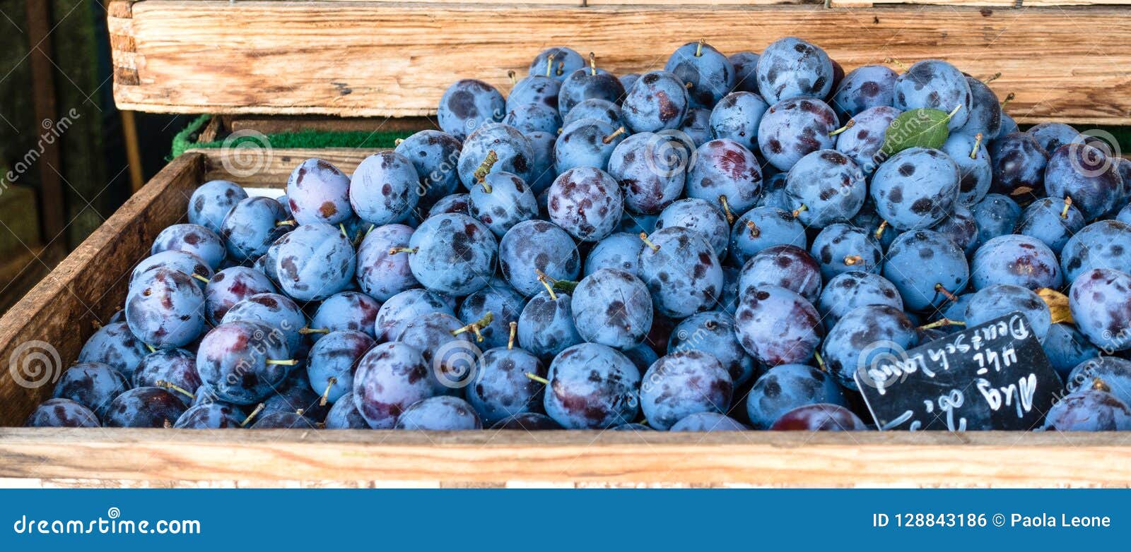 Blue Ripe Plums Stack on Sale in a Wooden Big Box Stock Photo - Image ...