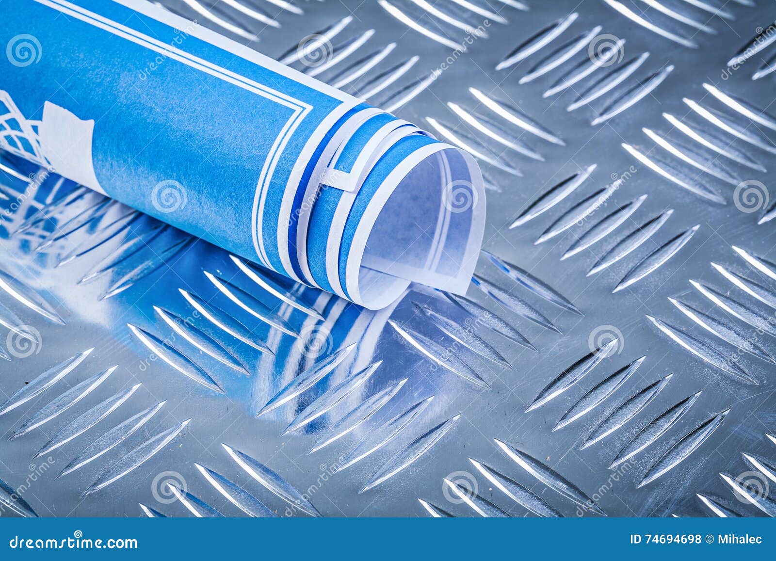 Blue Rolled Blueprints on Corrugated Metal Background Constructi Stock ...