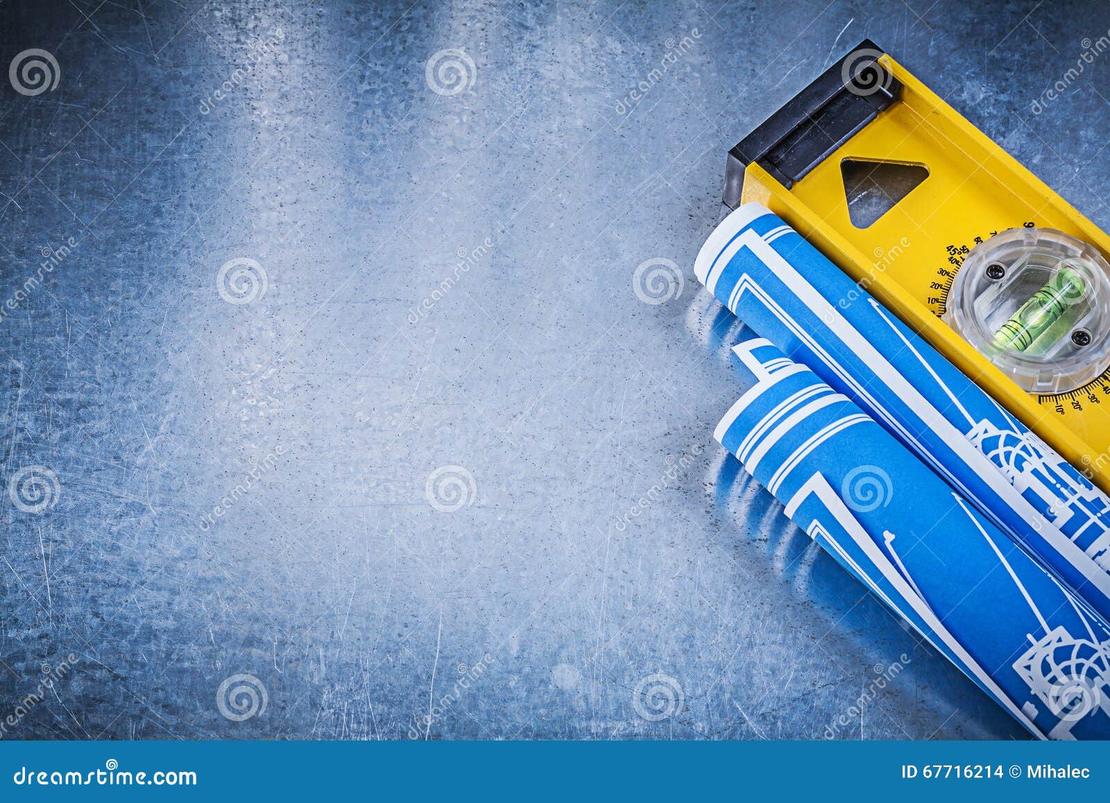 Blue Rolled Construction Plans Level on Metallic Background Main Stock ...