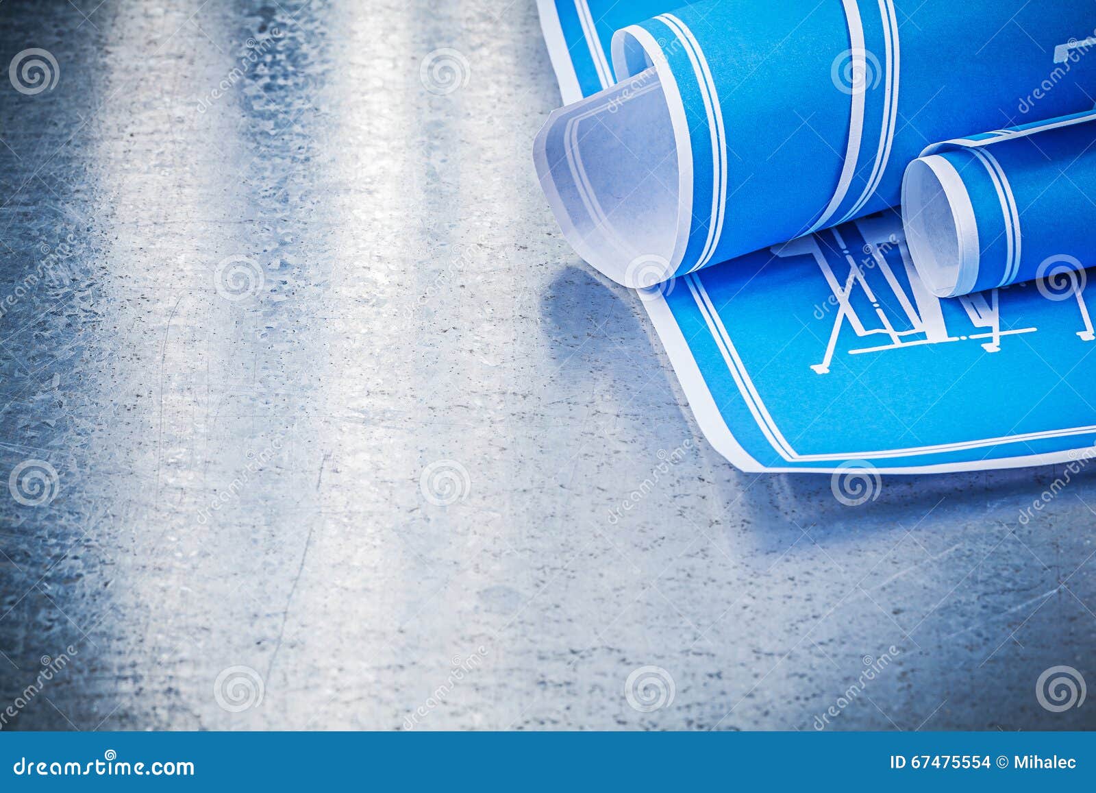 Blue Rolled Up Blueprints on Scratched Metallic Background Const Stock ...