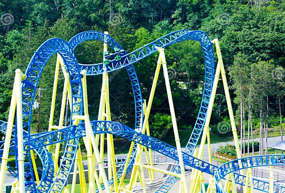 Blue rollercoaster stock image. Image of woods, skelter - 173600921