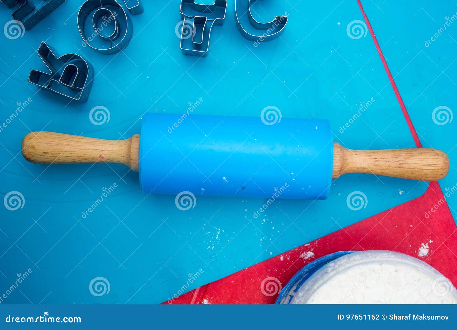 Blue Rolling Pin with Letters Forms Stock Photo - Image of rolling ...