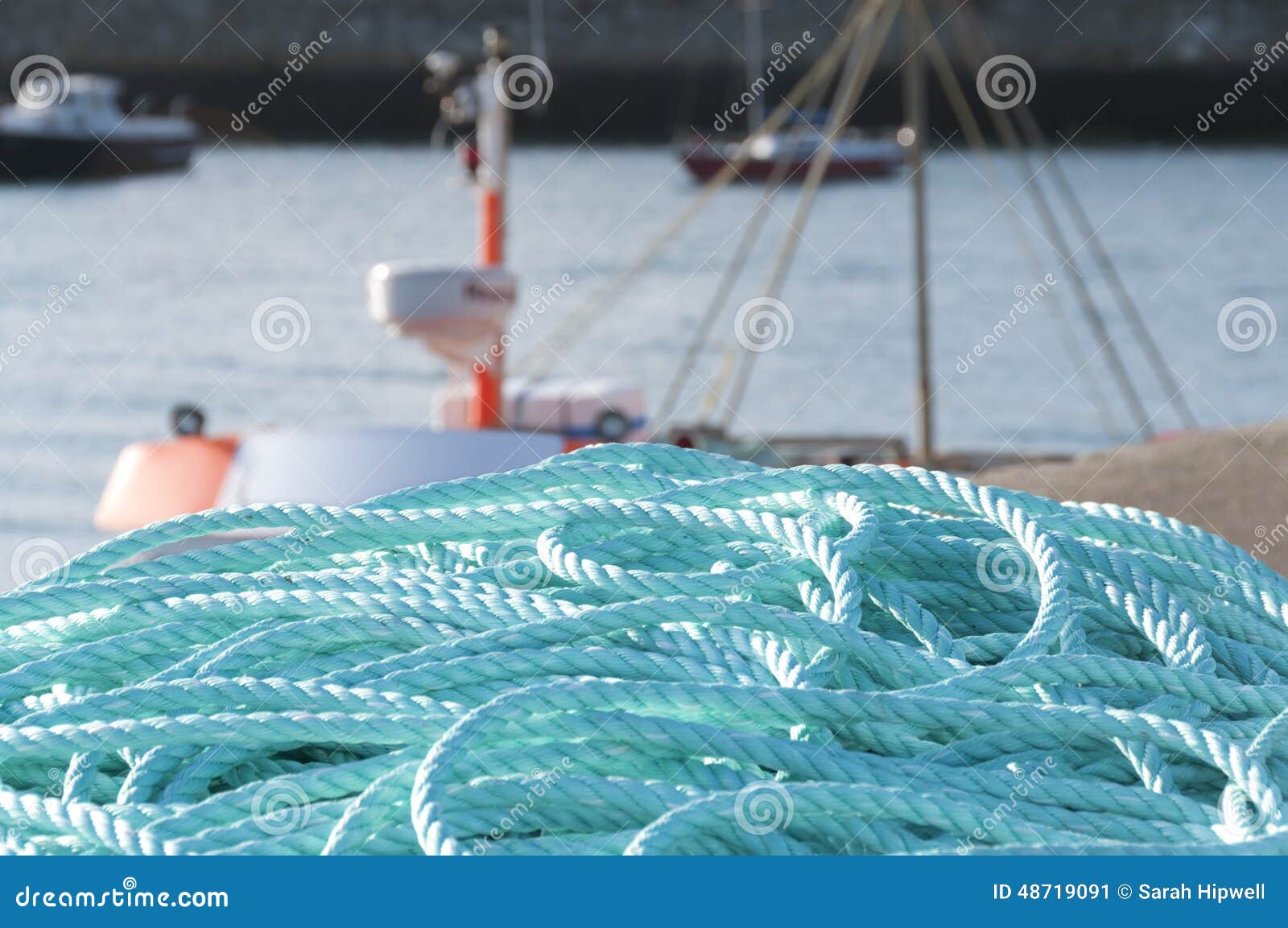 Blue Ropes Coiled by the Harbour Stock Image - Image of boat, outdoors ...