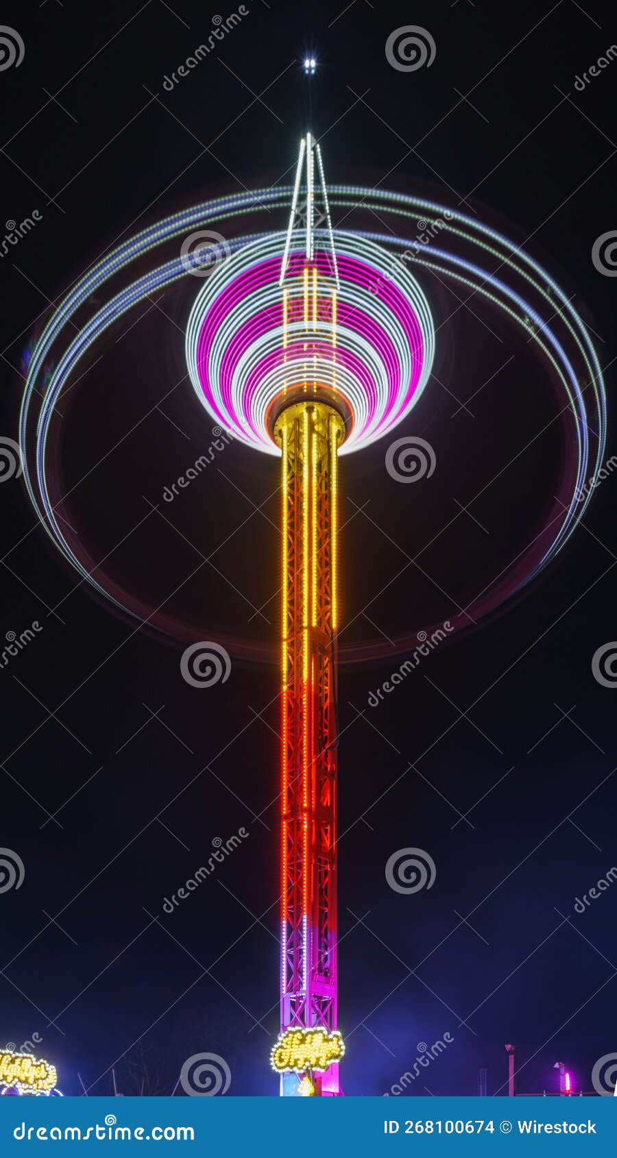 Blue Rotating Funfair Ride at Night, Light Trails, Long Exposure ...