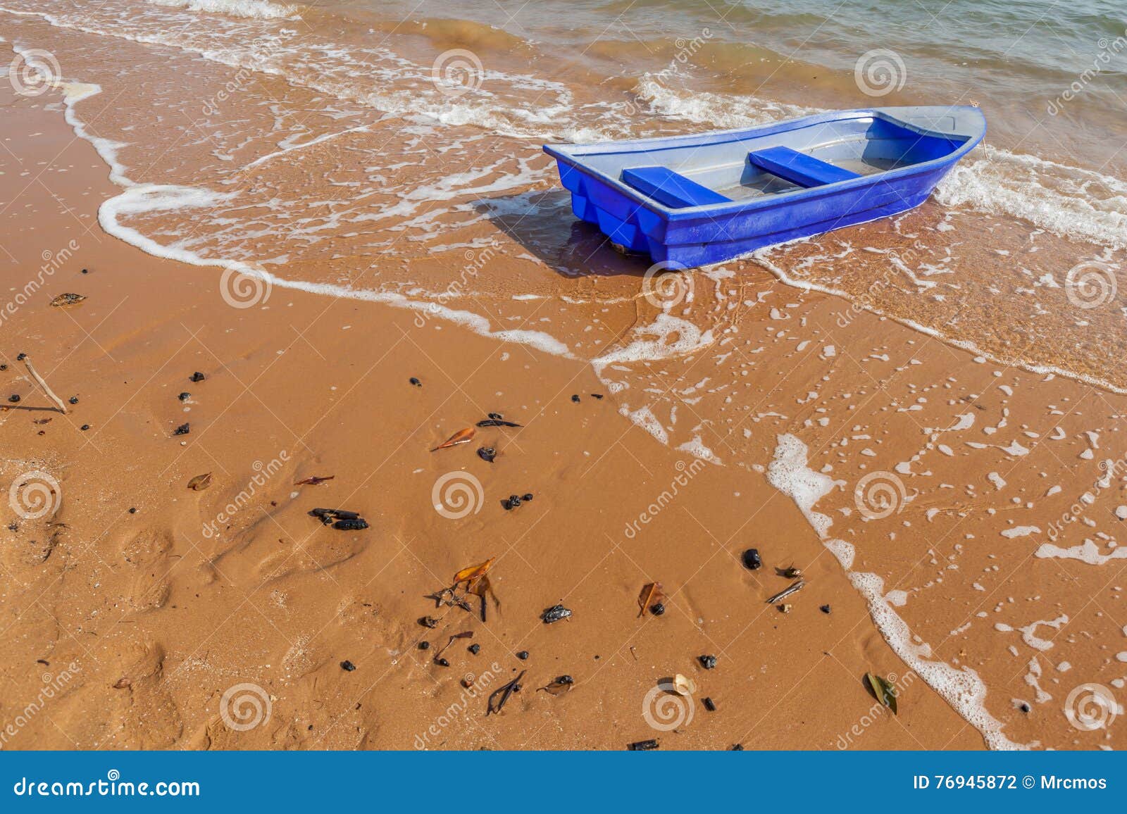 Blue Rowboat on the Beach with Lapped Small Wave. Stock Photo - Image ...