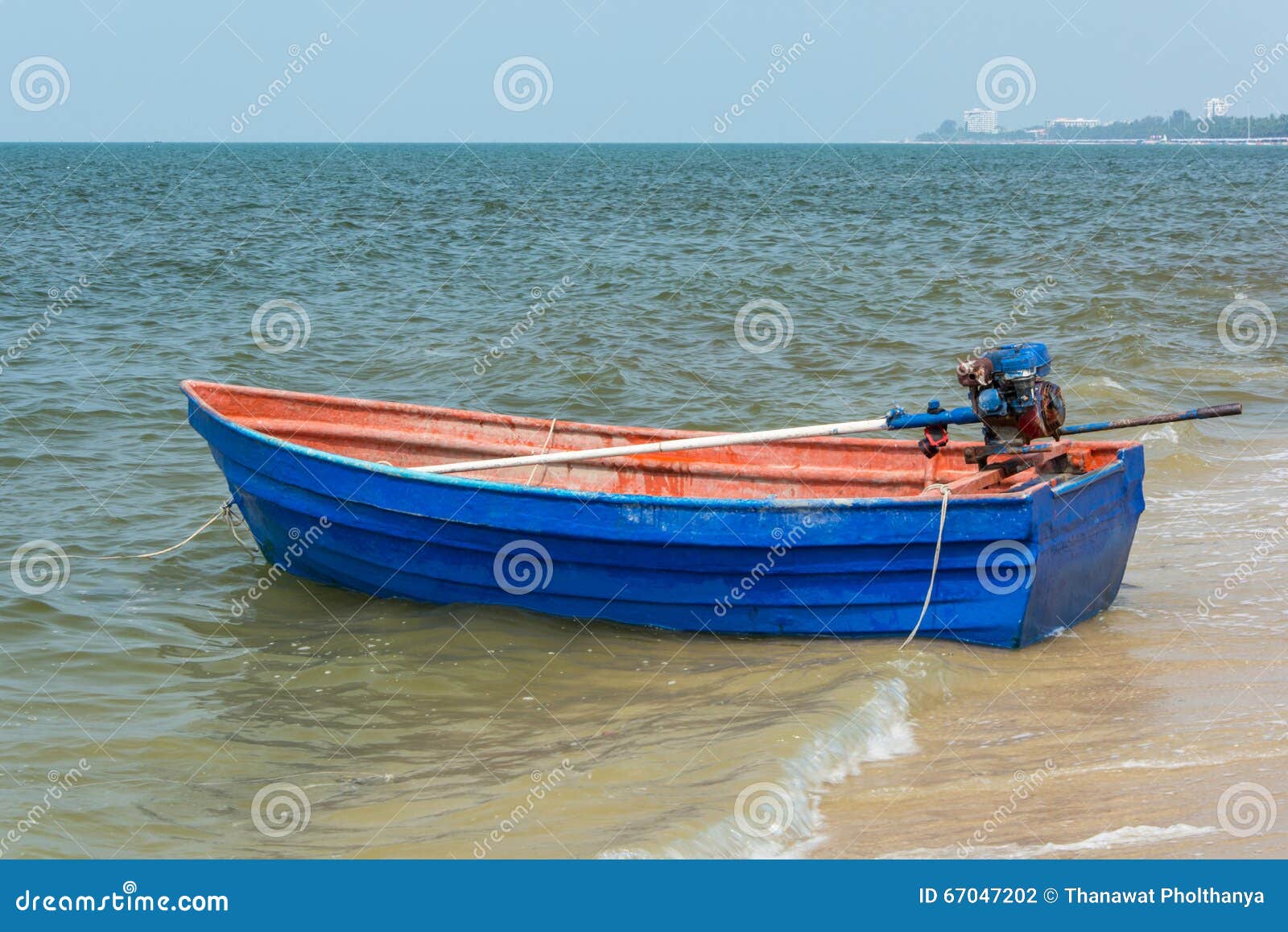 Blue rowboat on the beach stock photo. Image of transport - 67047202