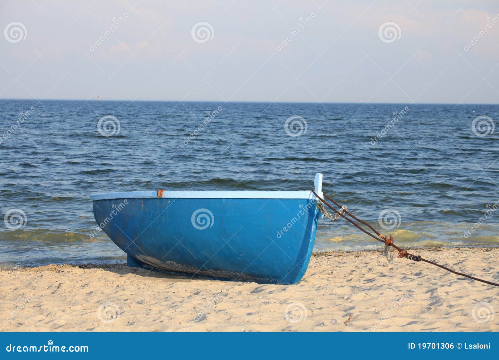 Blue rowing boat on shore stock photo. Image of clear - 19701306