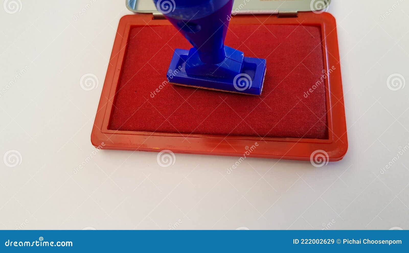 Blue Rubber Stamp and Red Ink Cartridge on White Background Stock Image ...