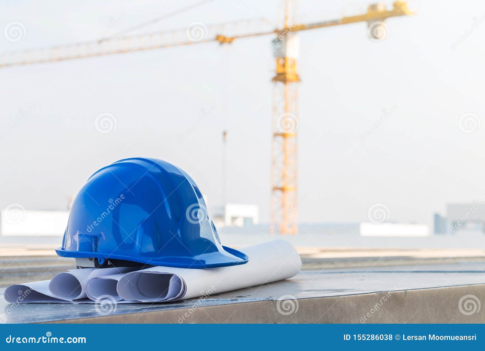 The Blue Safety Helmet Put on the Blueprint at Construction Site with ...
