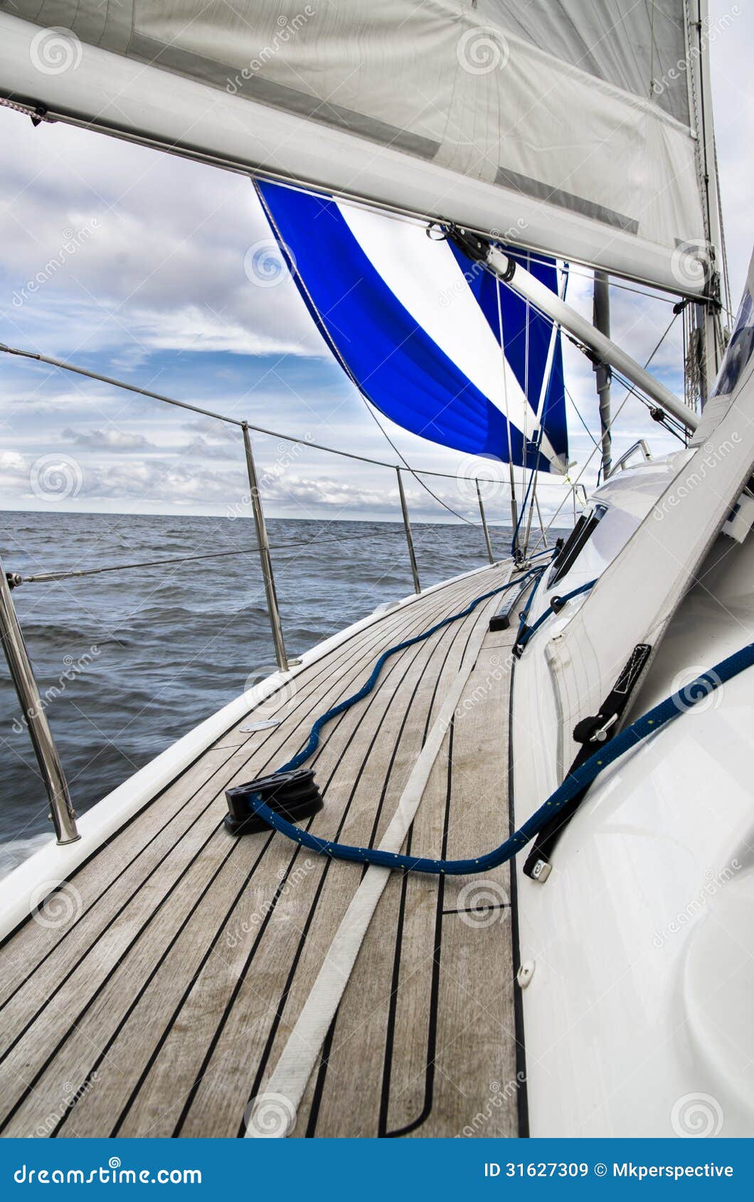 Blue sail stock image. Image of boat, clouds, color, ocean - 31627309