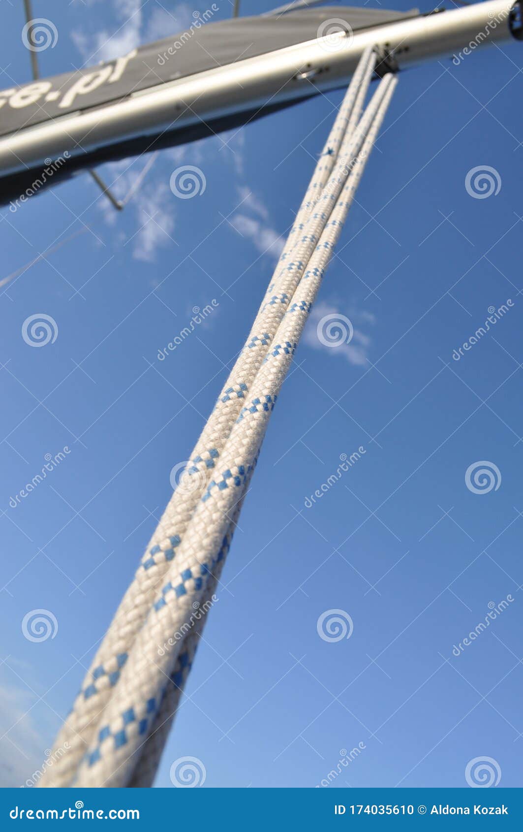 Blue Sailing Ropes with White Yacht Sail in the Background Stock Photo ...