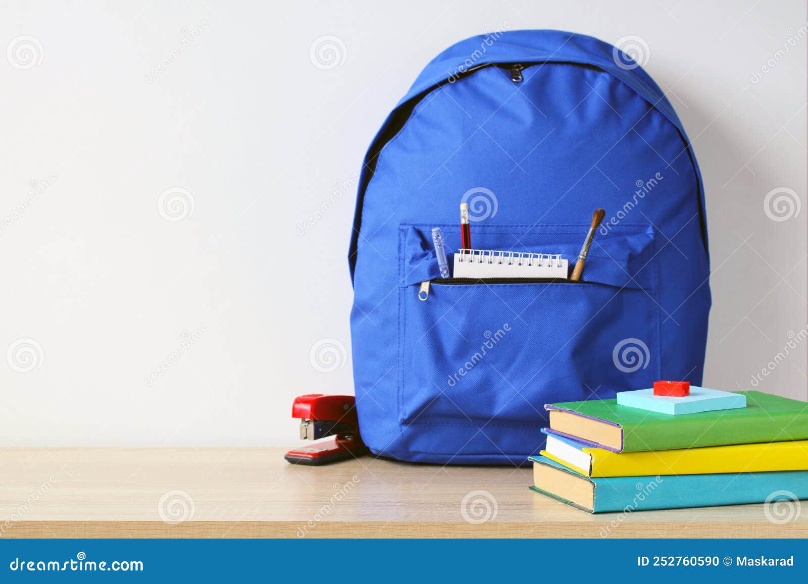 A Blue School Backpack and Textbooks. Stock Photo - Image of stationery ...