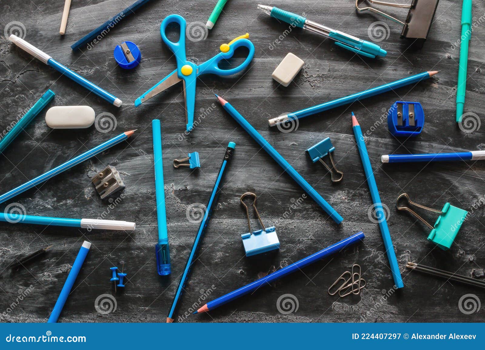 Blue School Supplies on a Blackboard Stock Image - Image of supply ...