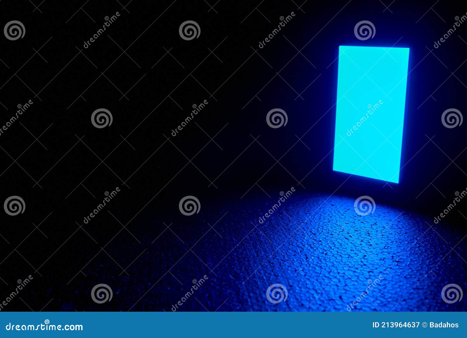 The Blue Screen of the Smartphone Glows on a Black Background Stock ...
