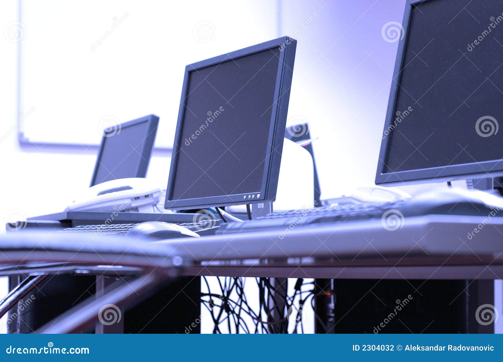 Blue Screens in Office Room Stock Photo - Image of monitors, laptop ...