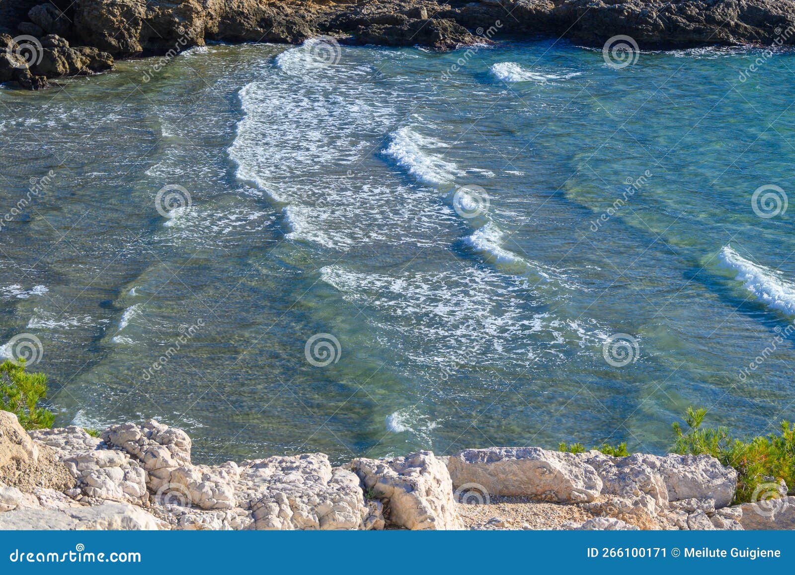 Blue Sea with Rocks of the Sides Stock Image - Image of rippled ...