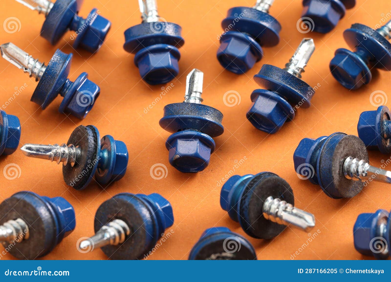 Blue Self-tapping Screws on Orange Background, Closeup Stock Image ...