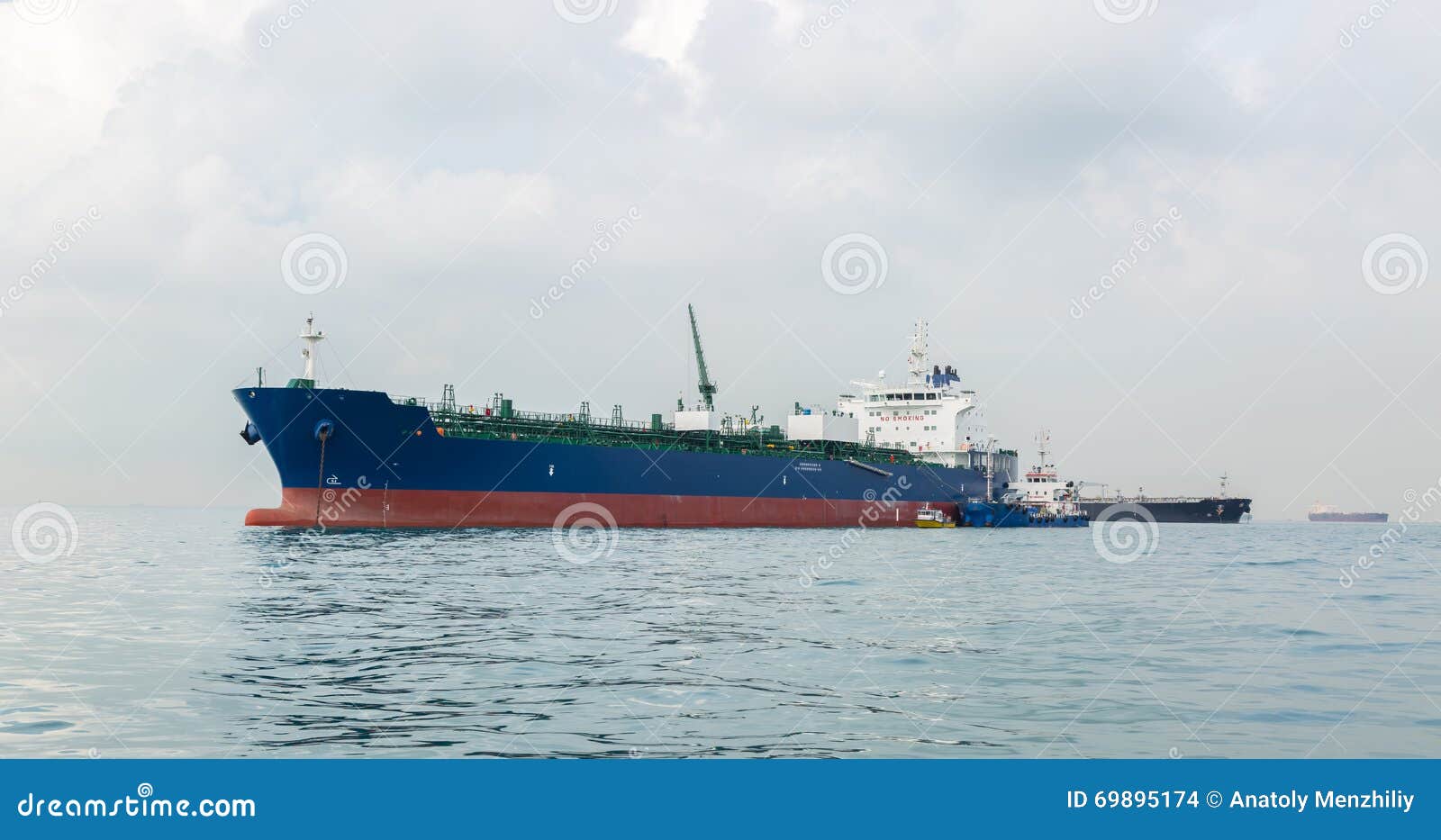 Blue Ship is Bunkering by Small Craft Stock Photo - Image of tanker ...