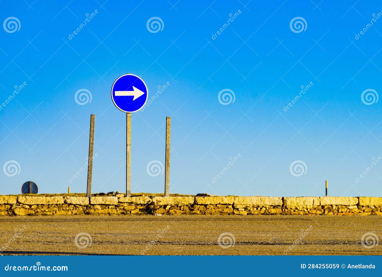 Blue Sign with White Arrow on Road Stock Image - Image of indication ...