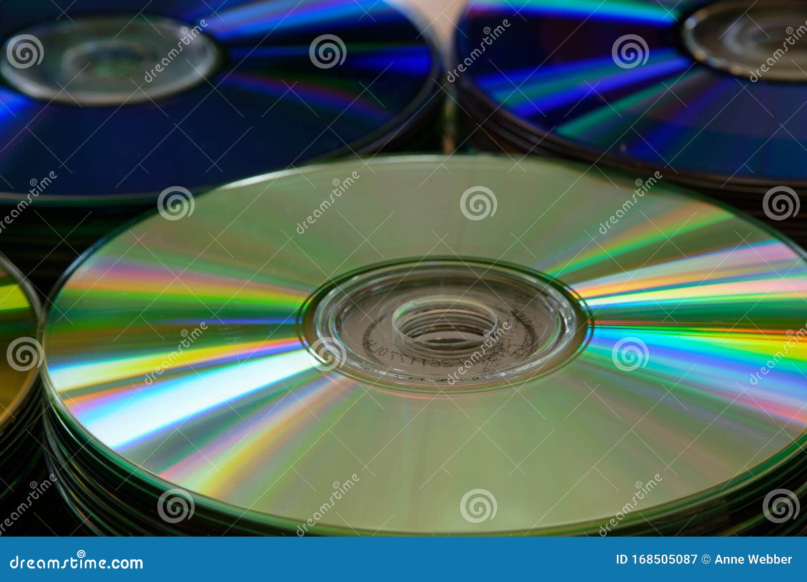 A Pile of Silver DVD Discs and Two Piles of Blue Ones Stock Image ...