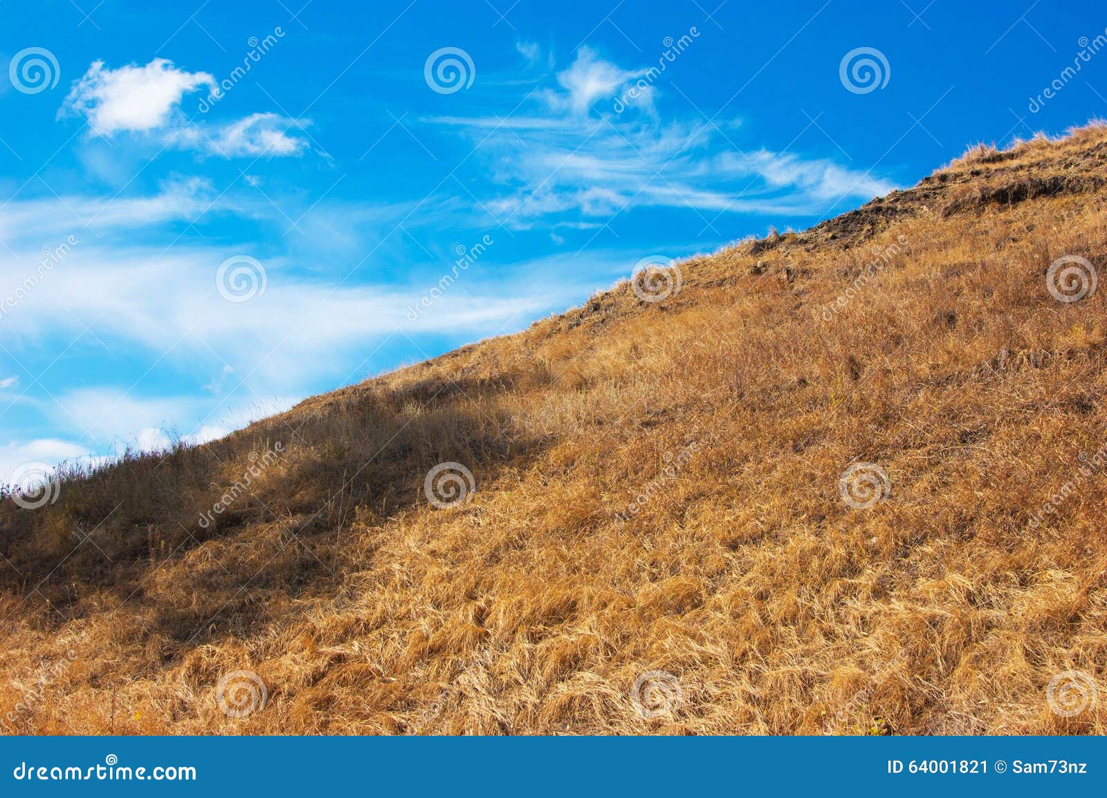 Blue sky, brown slope stock image. Image of farm, scenic - 64001821
