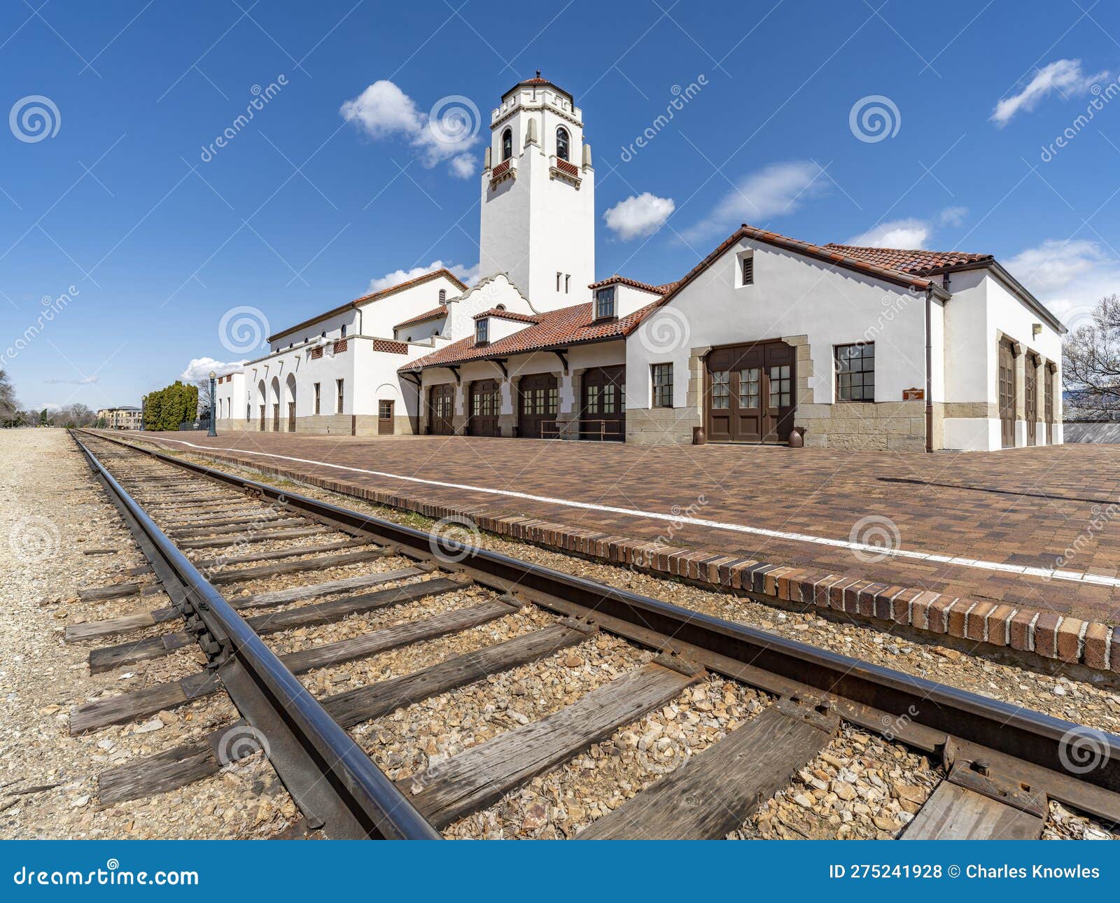Blue Sky And Clouds Of An Iconic Train Depot With Tracks Royalty-Free ...