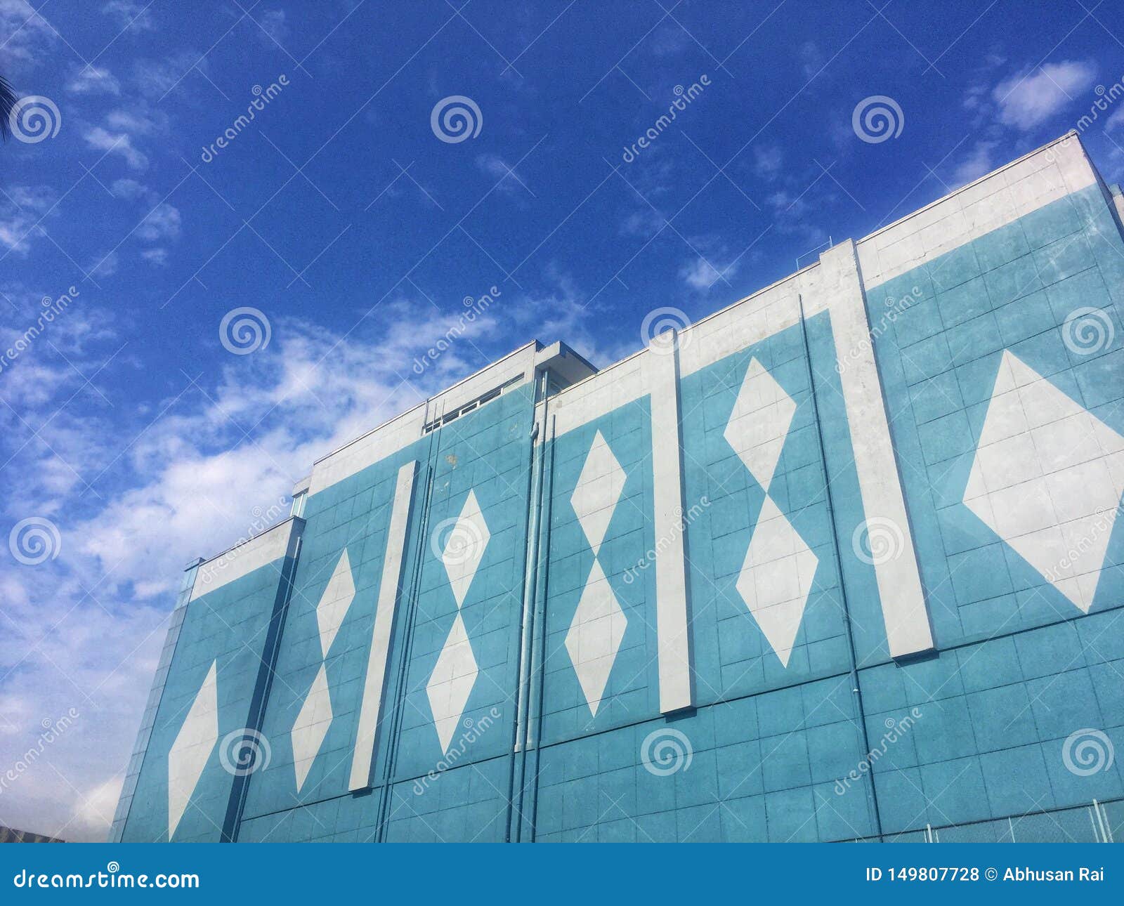 Blue Sky and Clouds and Large Building on the Foreground Stock Photo ...