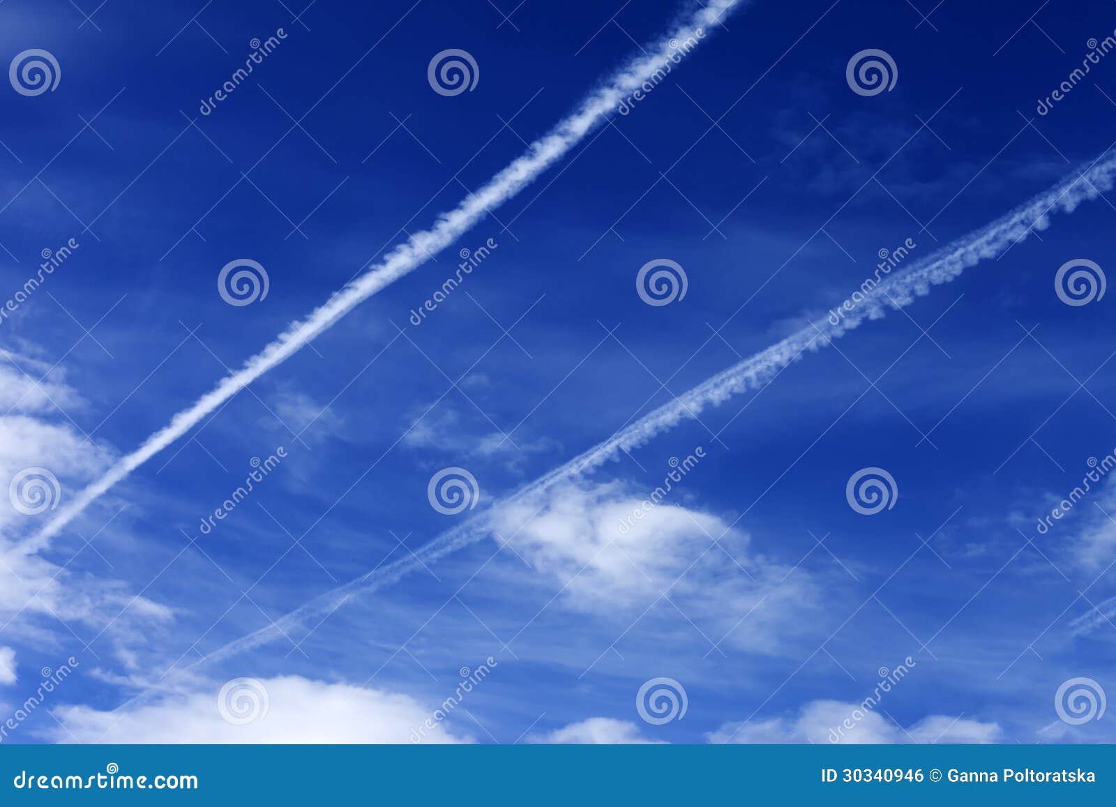 Blue sky with contrails stock photo. Image of landscape - 30340946